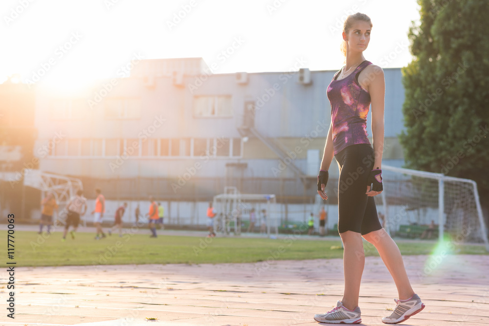 Sporty girl on the stadium. Football stadium. Slim sporty fitness woman ...