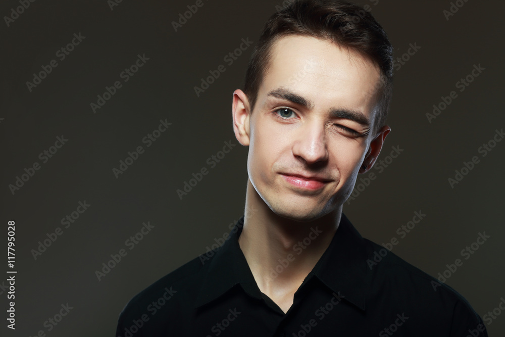 man winking Stock Photo | Adobe Stock
