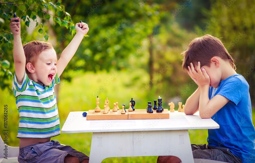 vivid emotions after the game of chess. two young chess players ...