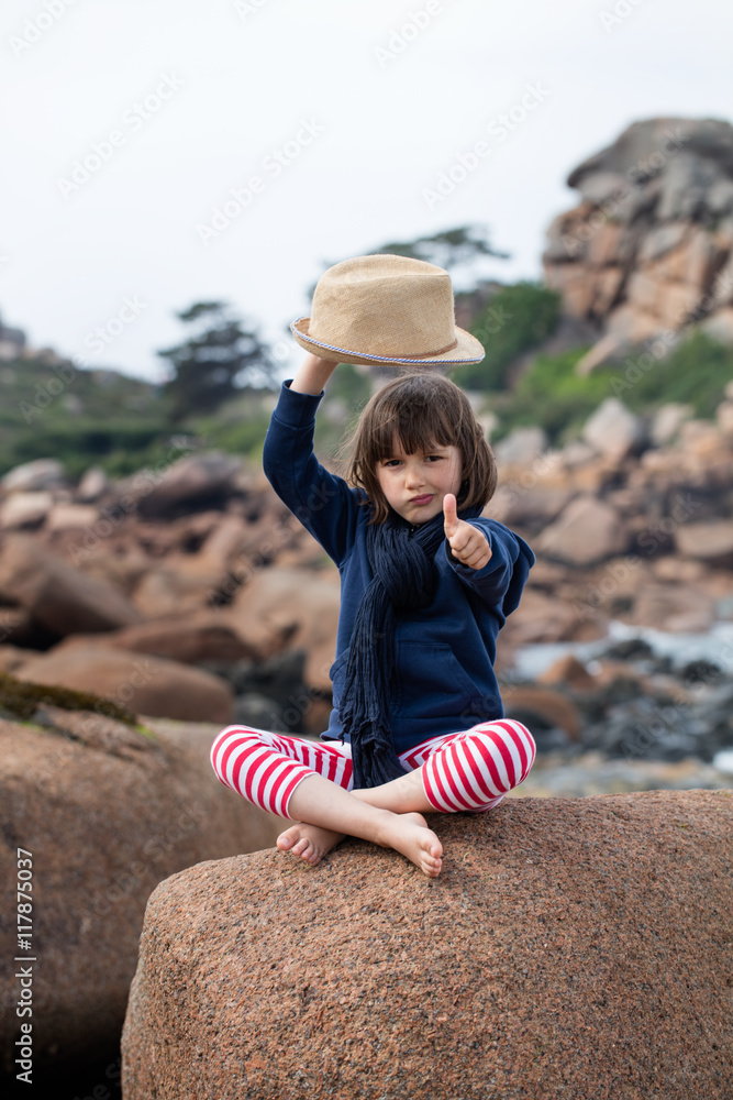beautiful child raising hat to say hello, showing thumbs up Stock Photo ...