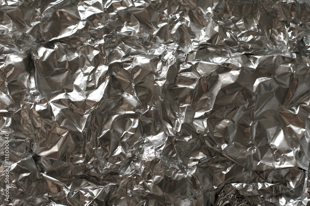 Silver foil background with shiny crumpled surface. Texture Stock Photo ...
