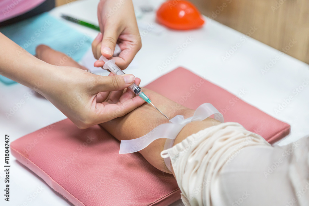 nurse inject needle syringe in the arm patient drawing blood sample for ...