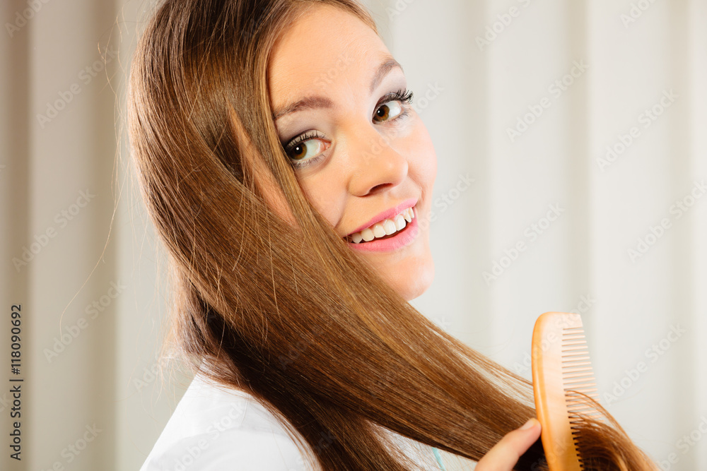 beautiful woman with long hair and comb Stock Photo | Adobe Stock