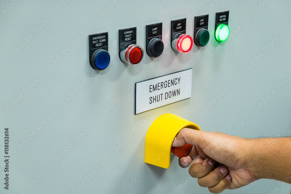 Technician is turning off emergency shutdown button on control p Stock ...