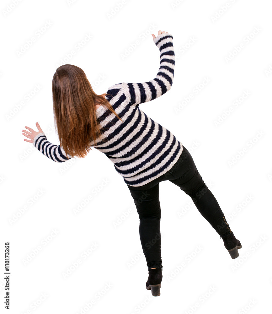 Balancing young woman. or dodge falling woman. Rear view people ...