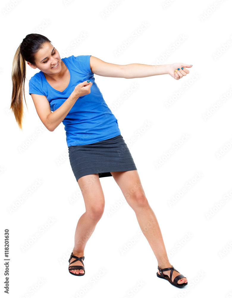 back view of standing girl pulling a rope from the top or cling to ...