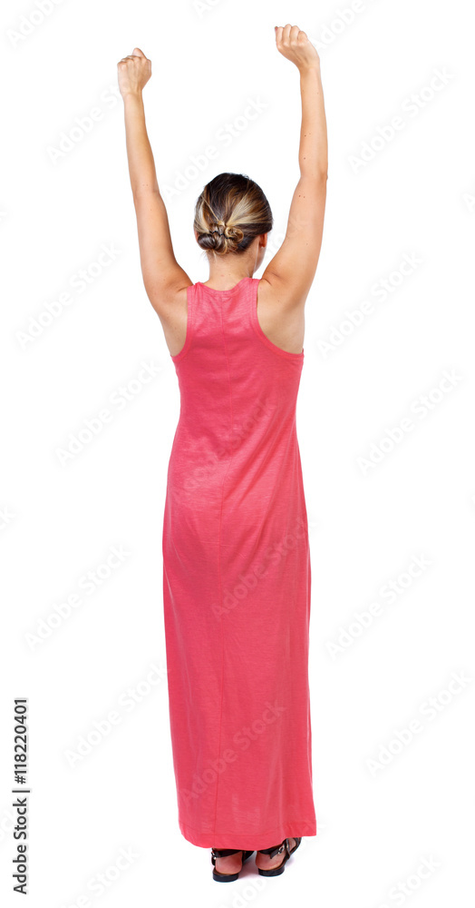back view of dancing young beautiful woman. girl watching. Rear view ...