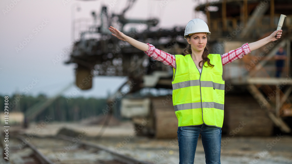 female worker gives a signal on background of career stacker Stock ...