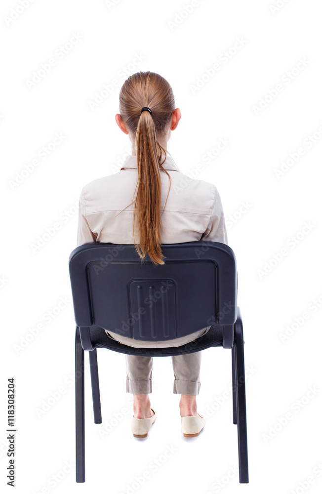 back view of young beautiful woman sitting on chair. girl watching ...