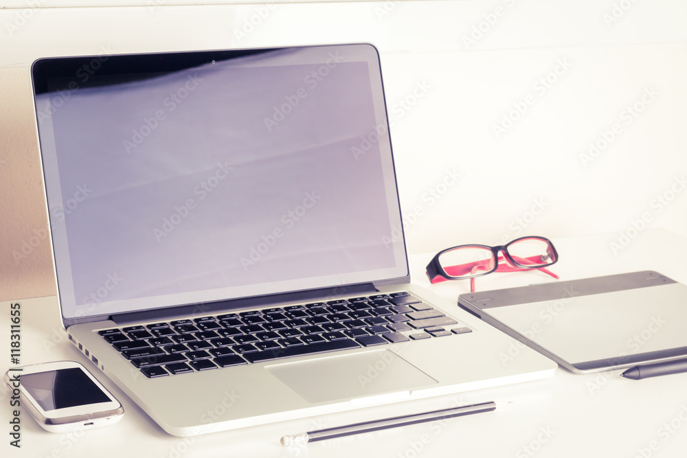 Office desk with laptop smart phone and business office backgrou Stock ...