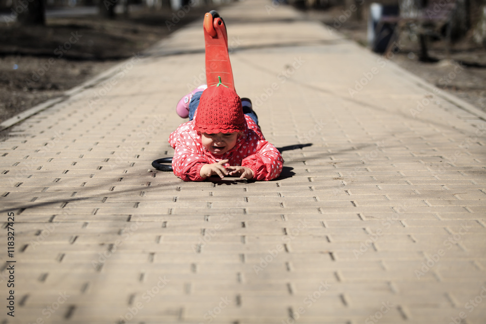 little girl fall off of scooter, kids safety Stock Photo | Adobe Stock