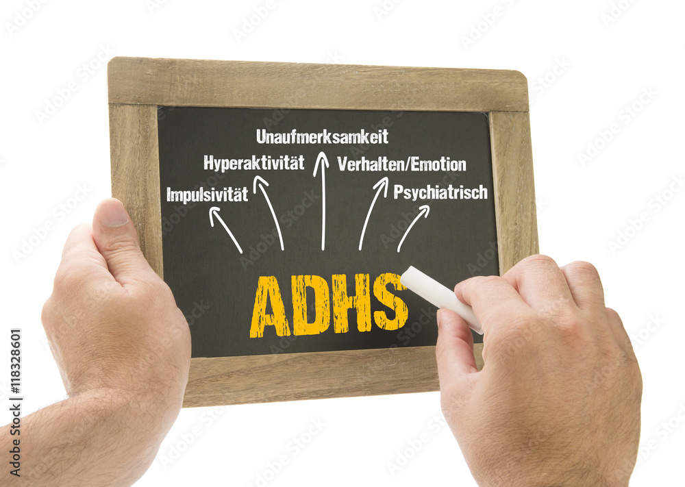 Hand schreibt ADHS Symptome auf Kreidetafel Stock Photo | Adobe Stock