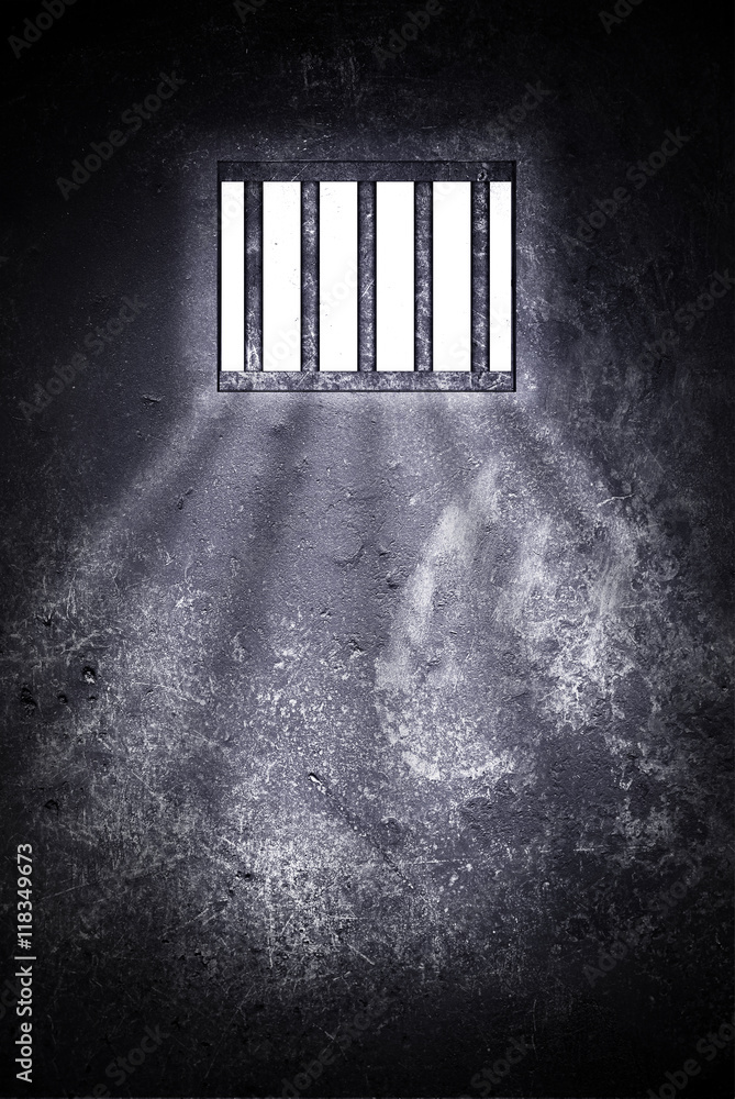 prison with light and shadow through a barred window background. high ...