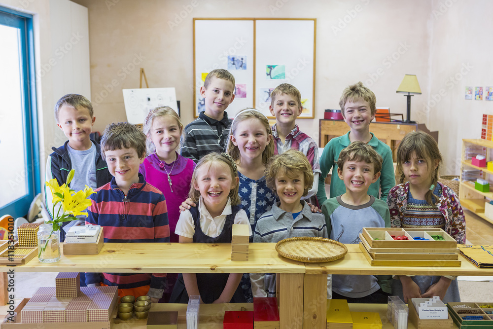 Portrait of students smiling together in classroom Stock Photo | Adobe ...