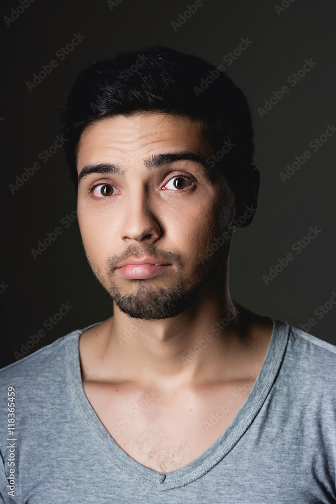 Portrait of a normal boy over grey background / Attractive young Stock ...