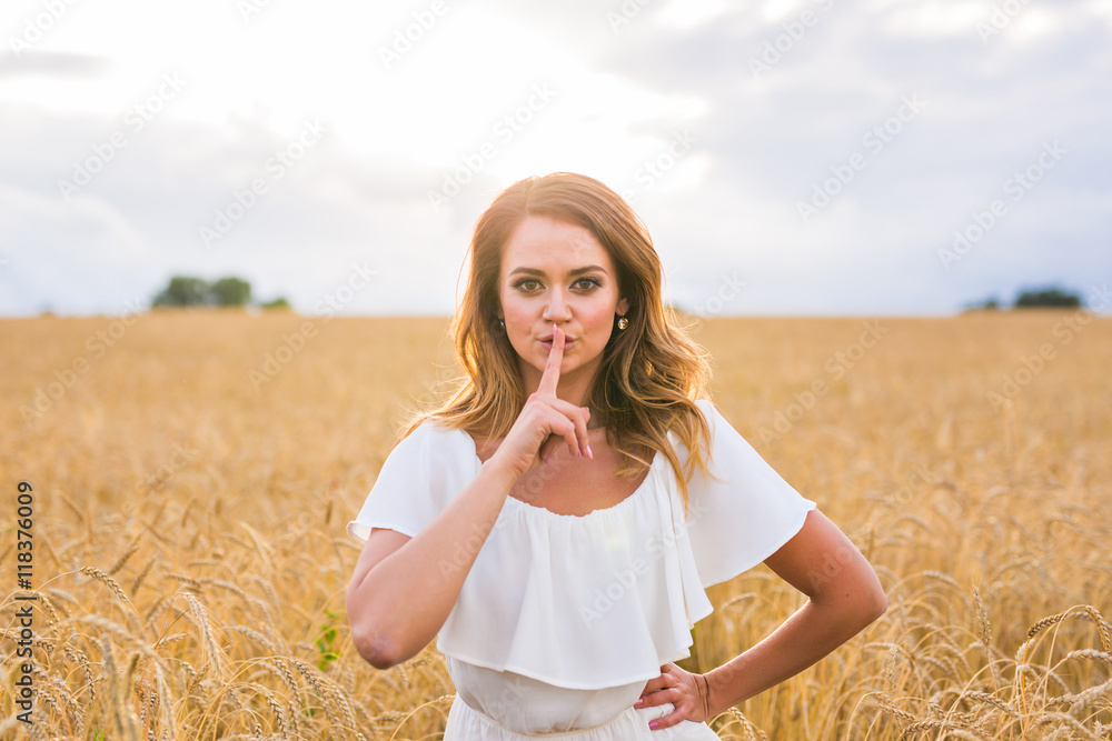 Quiet, secret and trust concept. Woman hand with silence sign symbol on ...