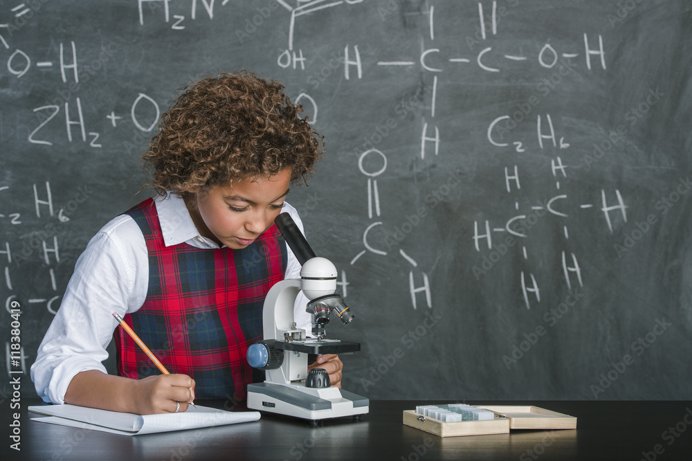 Student using microscope in science class Stock Photo | Adobe Stock