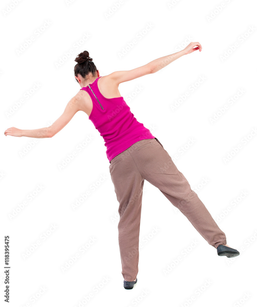Balancing young woman. or dodge falling woman. Rear view people ...