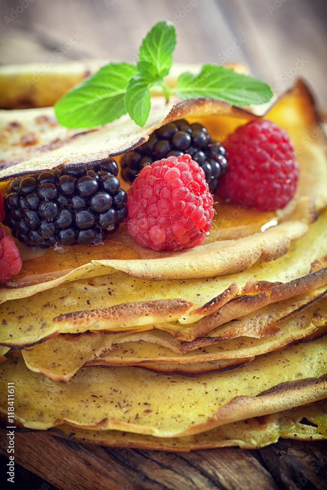 Pancake - Crepes with berries, mint and honey foto de Stock | Adobe Stock