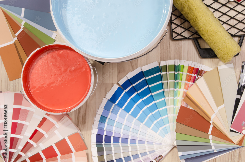 Blue and red paint cans and samples with different color shades with ...