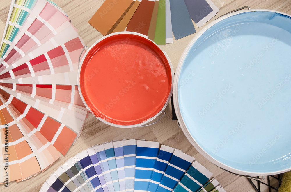 Blue and red paint cans and samples with different color shades with ...