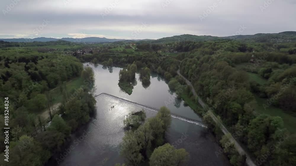 There is a river and there are many forests surrounding it. The day ...