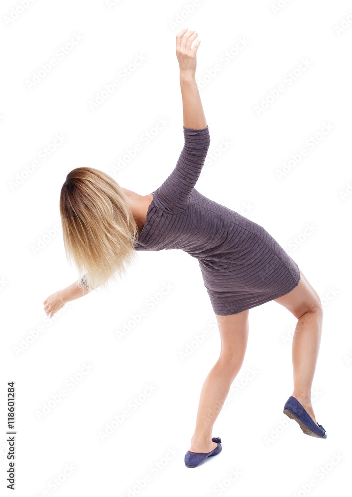 Balancing young woman. or dodge falling woman. Rear view people ...