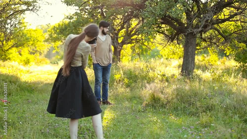 Man photographing woman Stock Video | Adobe Stock