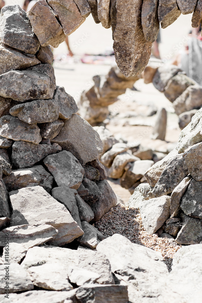 Unusual piles of stones of different sizes. Unequal stones glued ...