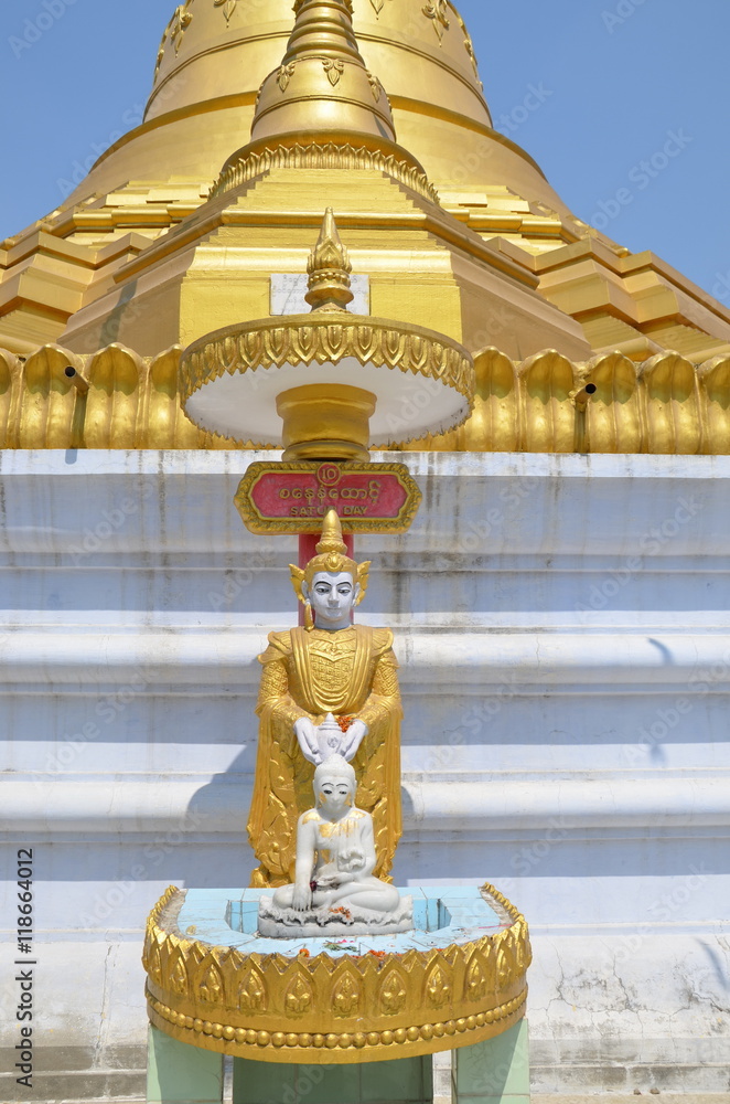 Statue of golden Saturday Buddha in Kushinagar, India. Kushinagar is a ...