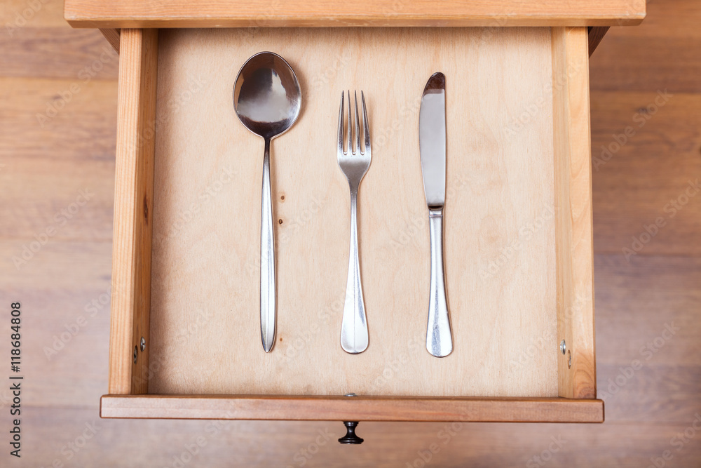 table knife, fork, spoon in open drawer Stock Photo | Adobe Stock