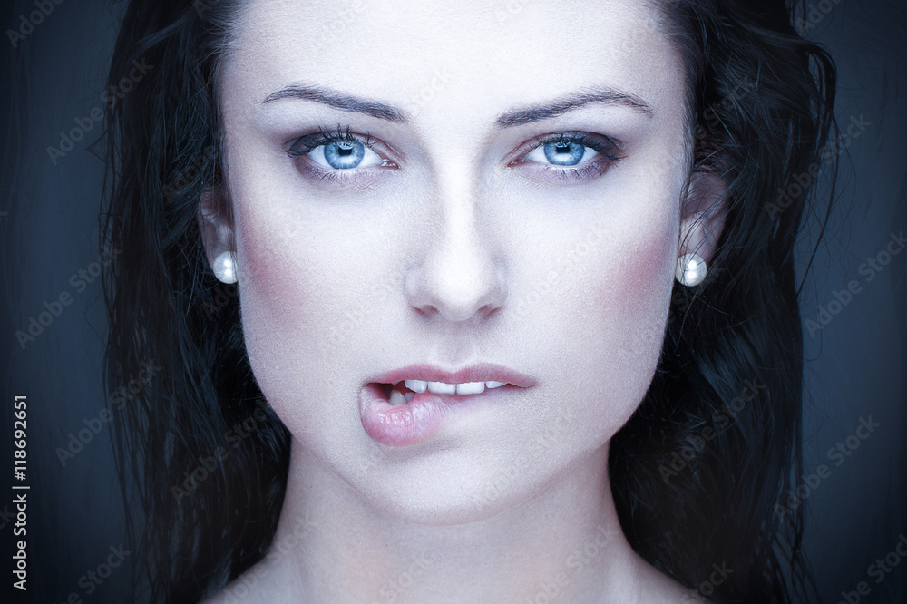 Sexy brunette woman bite lips portrait Stock Photo | Adobe Stock