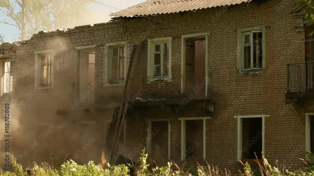 Demolition old house. excavator destroys old brick two-storey building ...