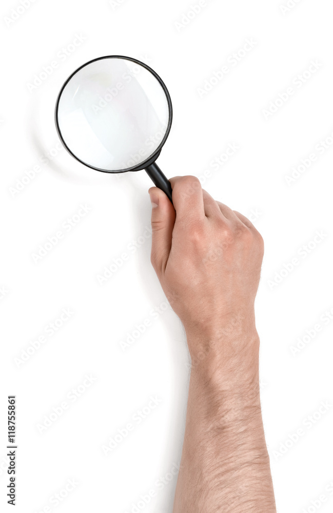 Hand of man holding the magnifying glass isolated on white background ...