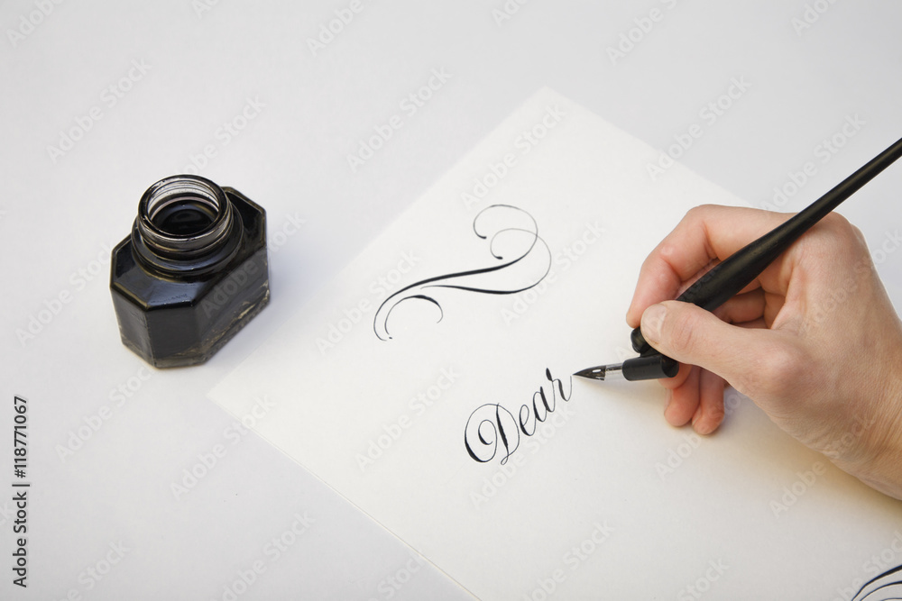 Writing with quill pen. Spilled ink and fountain pen concept image for ...