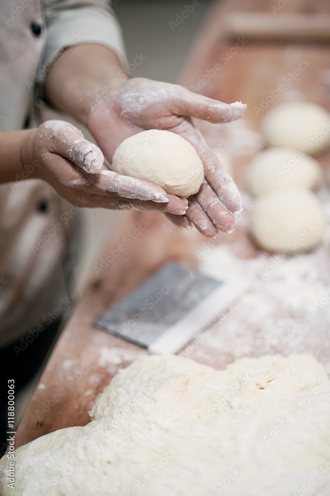 bakery concept. Chef cook in uniform putting filler of spinach and soft ...