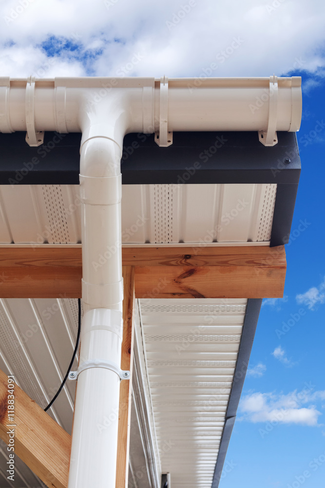 SIP panel house construction. New white rain gutter. Drainage System ...