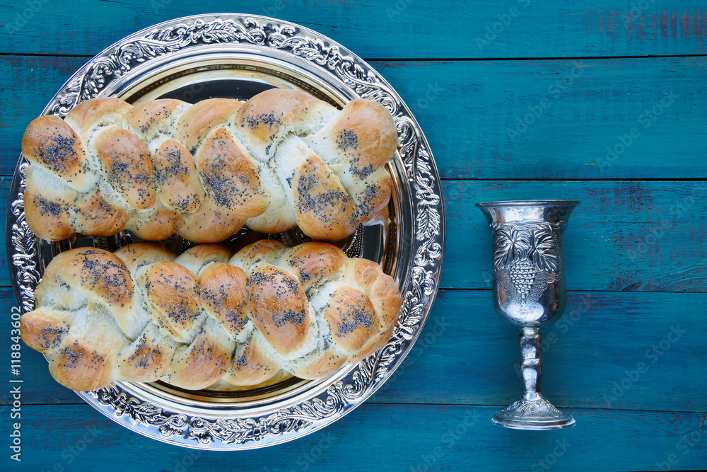 Flat lay view of Shabbat eve table with uncovered challah bread Stock ...