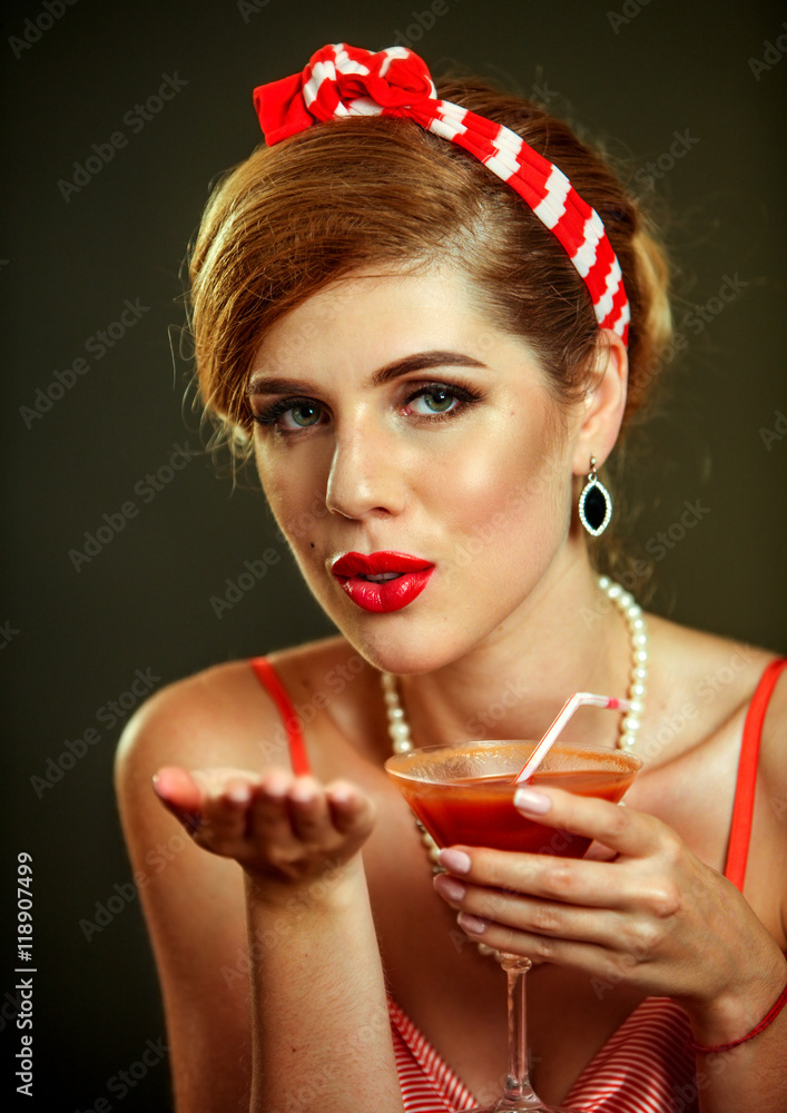 Girl in pin-up style drink martini cocktail and blow kiss . Pin-up ...