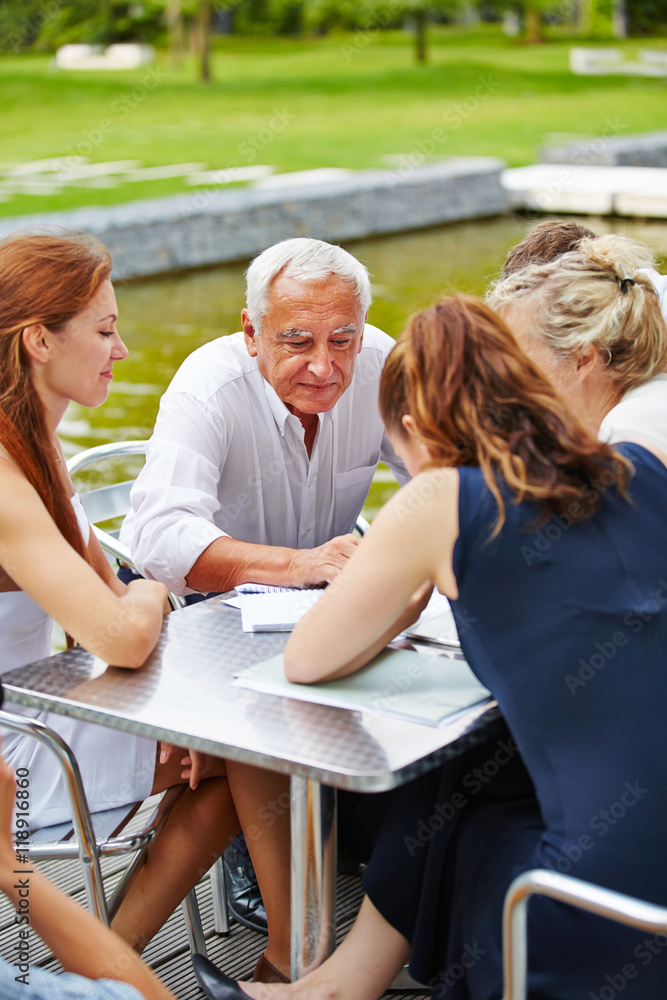 Senior manager with business team in meeting Stock Photo | Adobe Stock