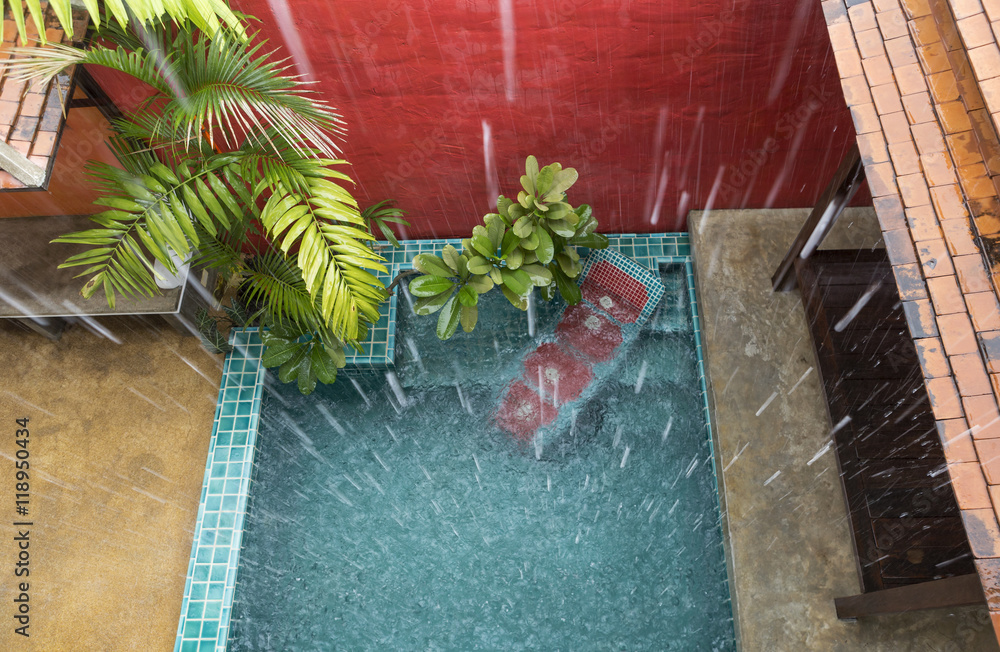 Rain drop to the swimming pool, rainy season, tropical rain Stock Photo ...