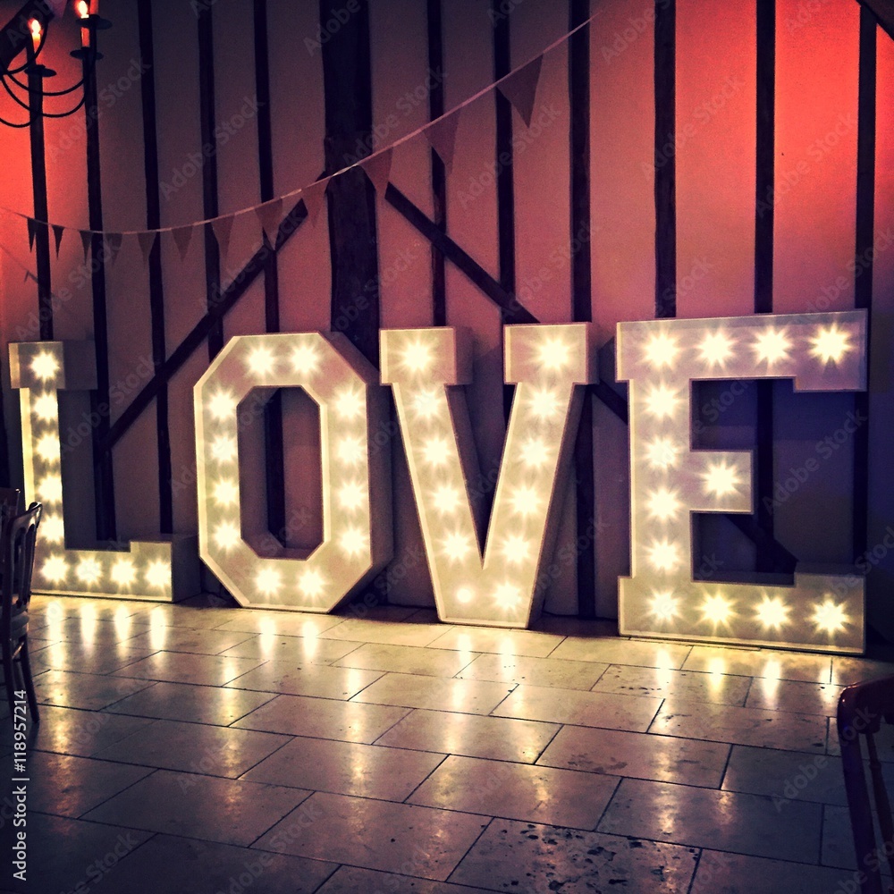 Love Sign Word Lighting Bulbs Against Barn Wall Stock Photo | Adobe Stock
