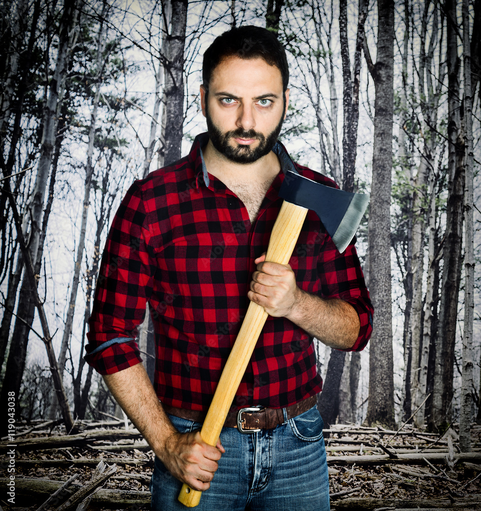 Foto Stock Lumberjack among the trees. | Adobe Stock