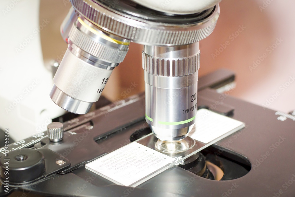 Laboratory microscope. Close-up view of objectives lenses and stage ...