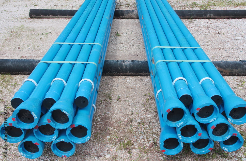 Blue PVC plastic pipes and fittings used for underground water supply ...