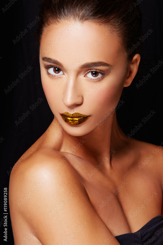 Beautiful model with olive skin, perfect skin texture and gold lip ...