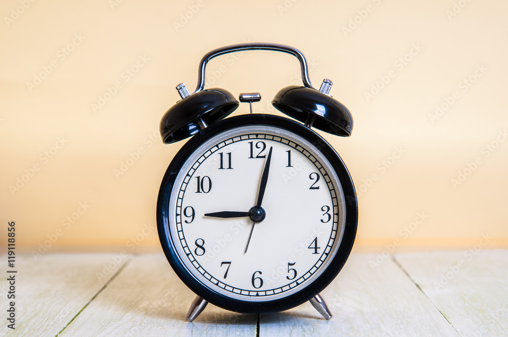 Vintage background with retro alarm clock 9pm am on wooden table Stock ...