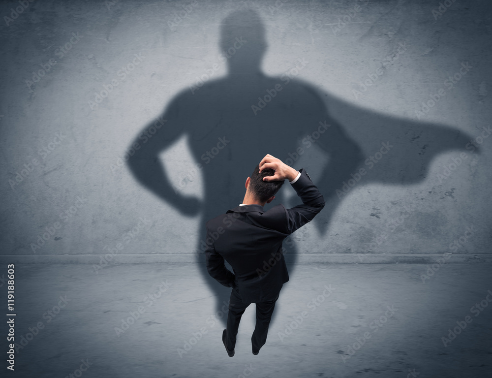 Successful businessman with superhero shadow Stock Photo | Adobe Stock