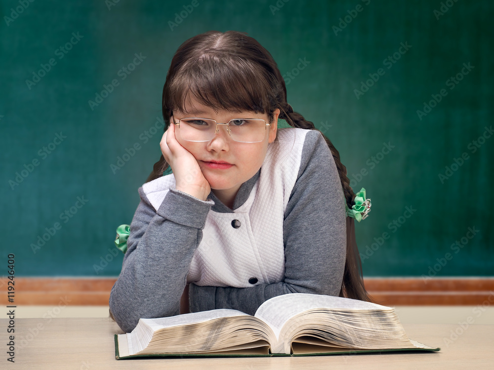 Girl in the classroom. Great tutorial, blackboard. Child obesity full ...