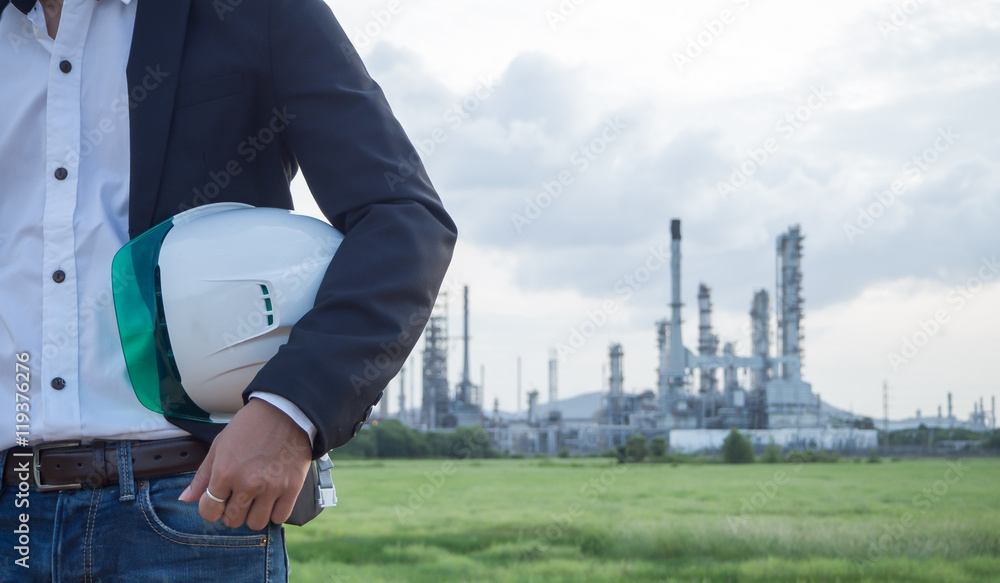refinery engineer with white safety helmet see drawing standing in ...